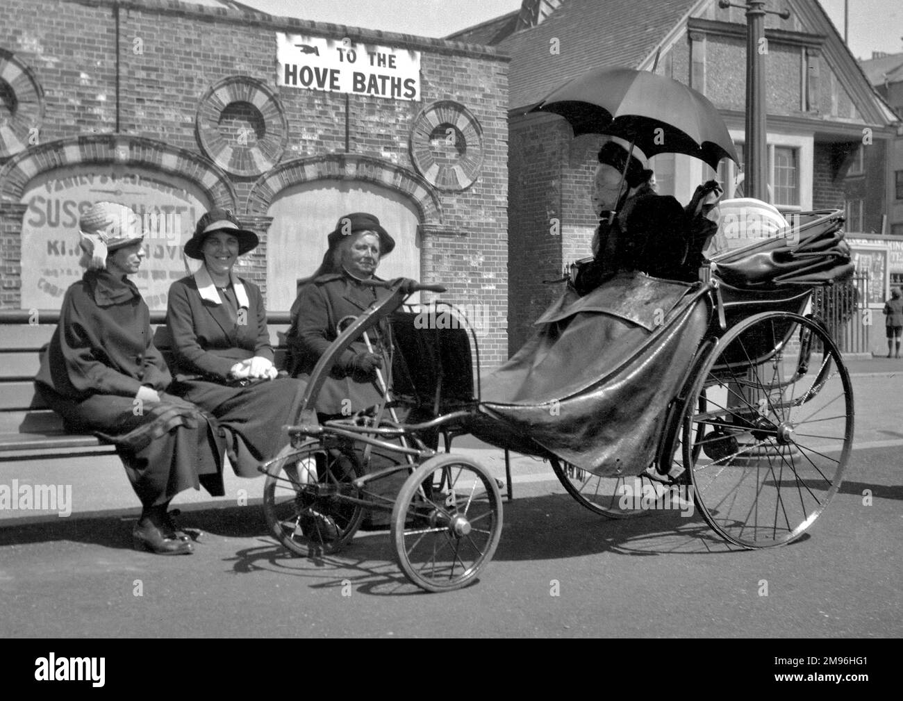 Elderly woman sit on Black and White Stock Photos & Images - Alamy