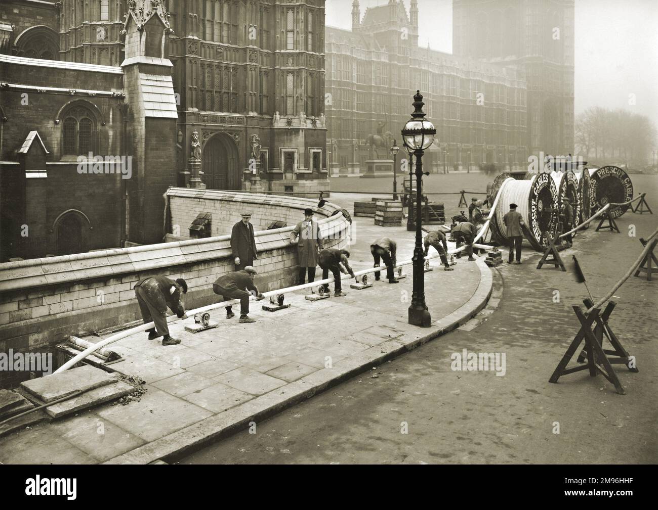Laying cables in the street outside the Houses of Parliament, Central ...