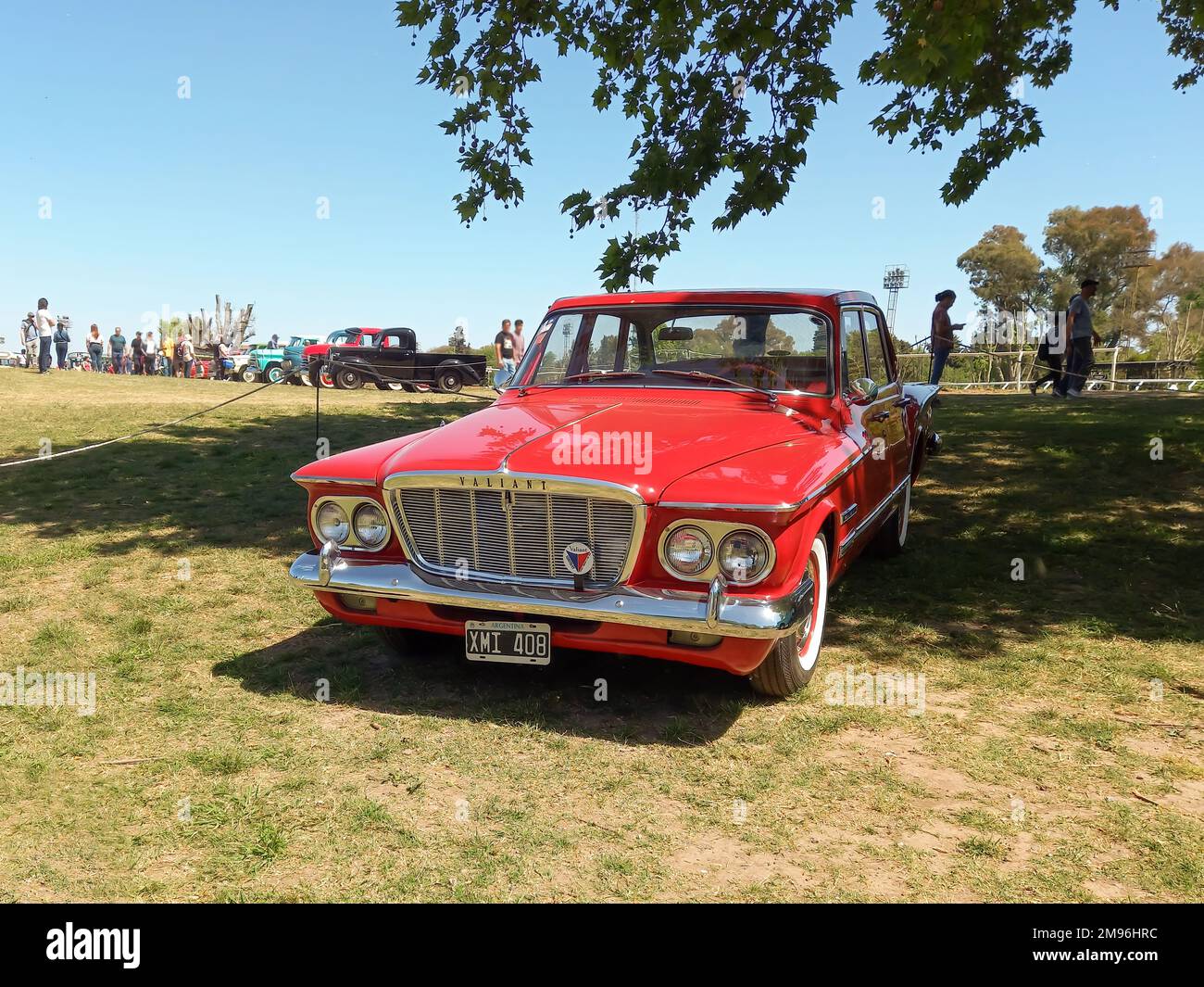 old red 1961 Chrysler Plymouth Valiant V 200 four door sedan in a park ...