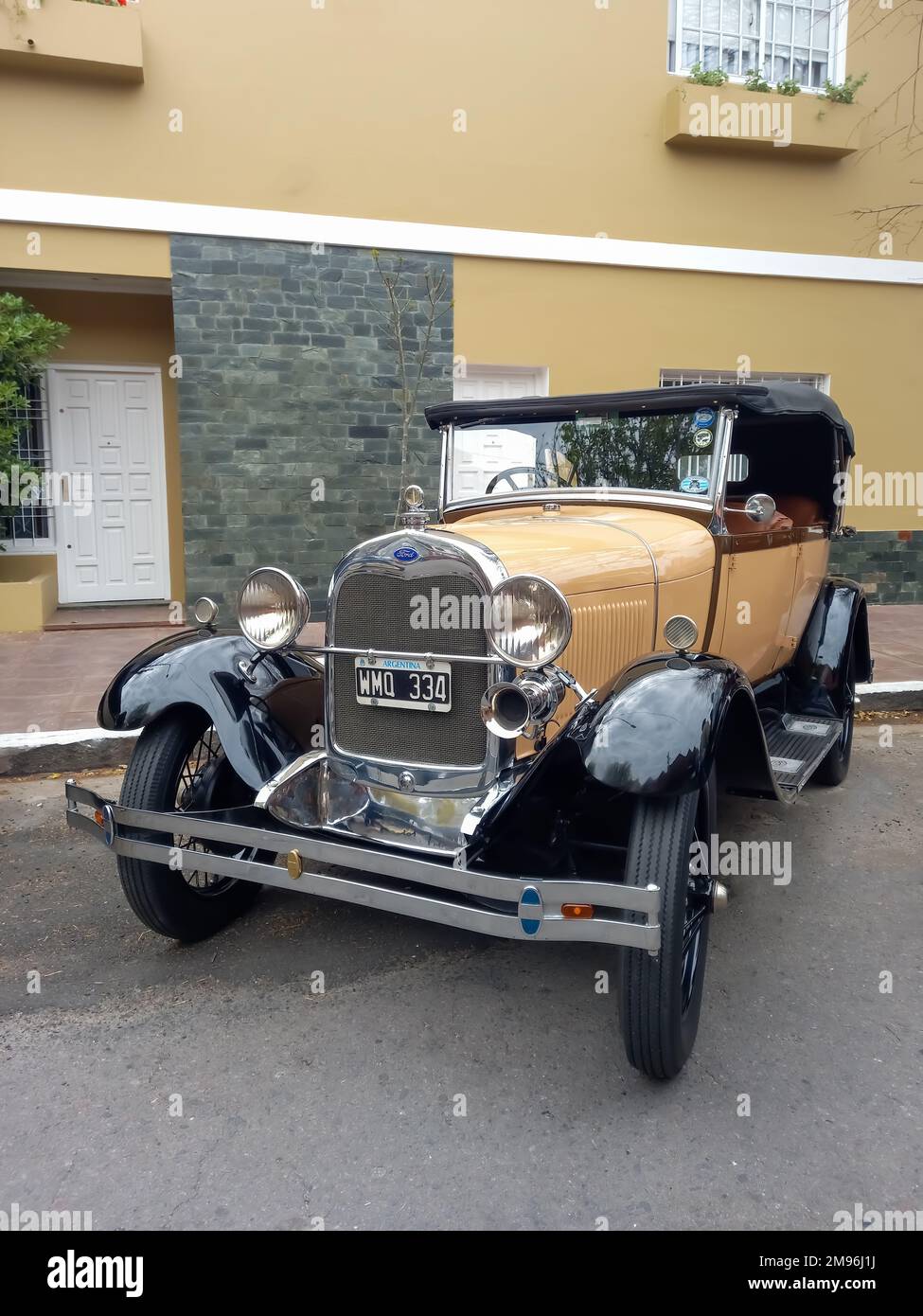 Old black and cream 1930s Ford Model A double phaeton convertible ...