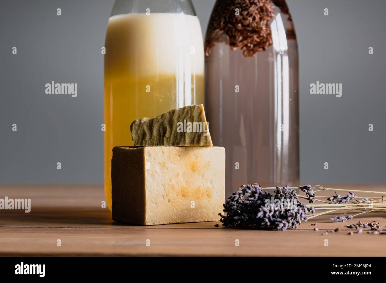Bottles of homemade laundry on a table, Marseille grated soap, DIY, do ...