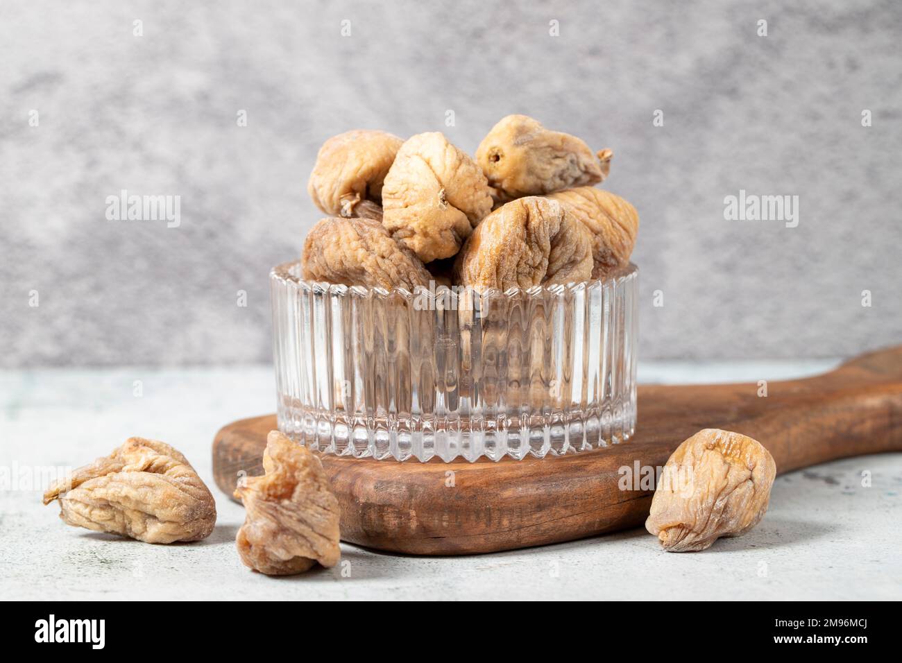 Dried figs on stone background. Sun-dried dried figs in glass bowl ...