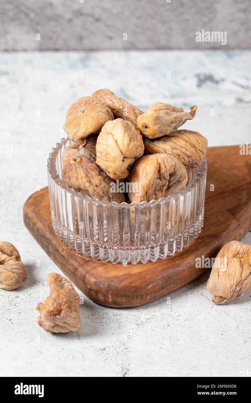 Dried figs on stone background. Sun-dried dried figs in glass bowl ...