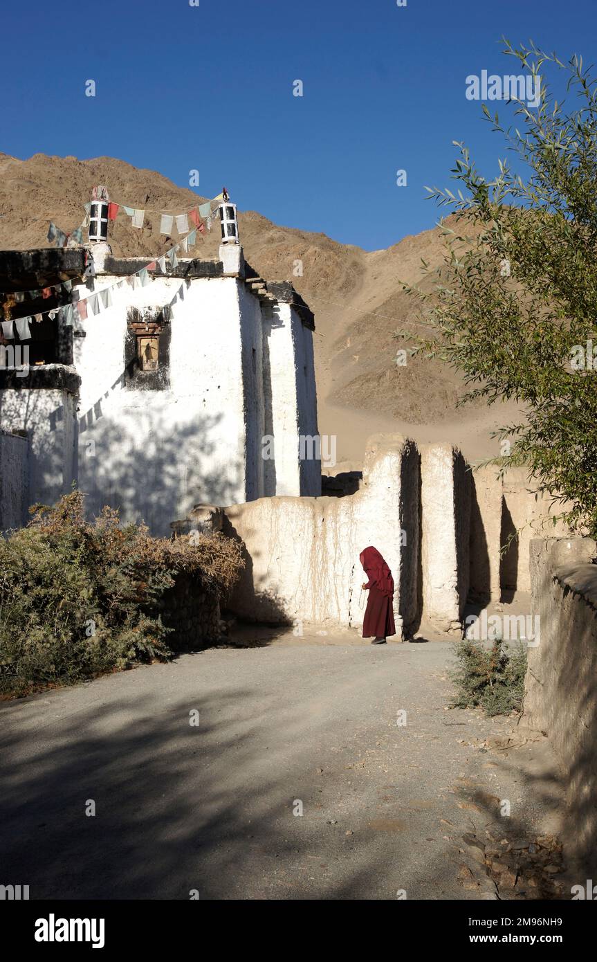 India, Jammu and Kashmir, Ladakh, Ranbirpura: Old nun, typical house ...