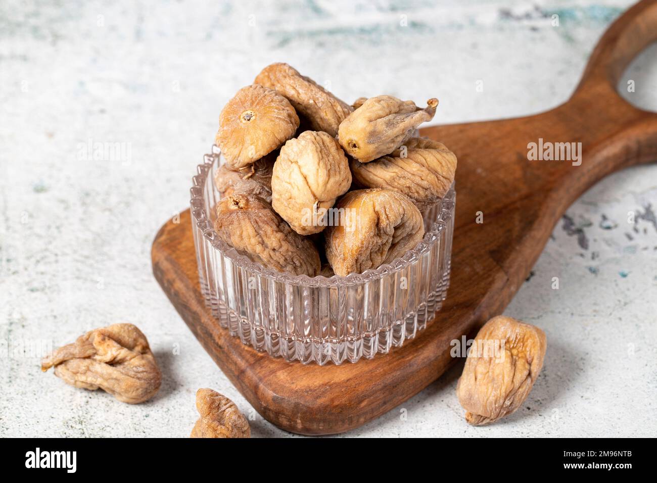 Dried figs on stone background. Sun-dried dried figs in glass bowl ...