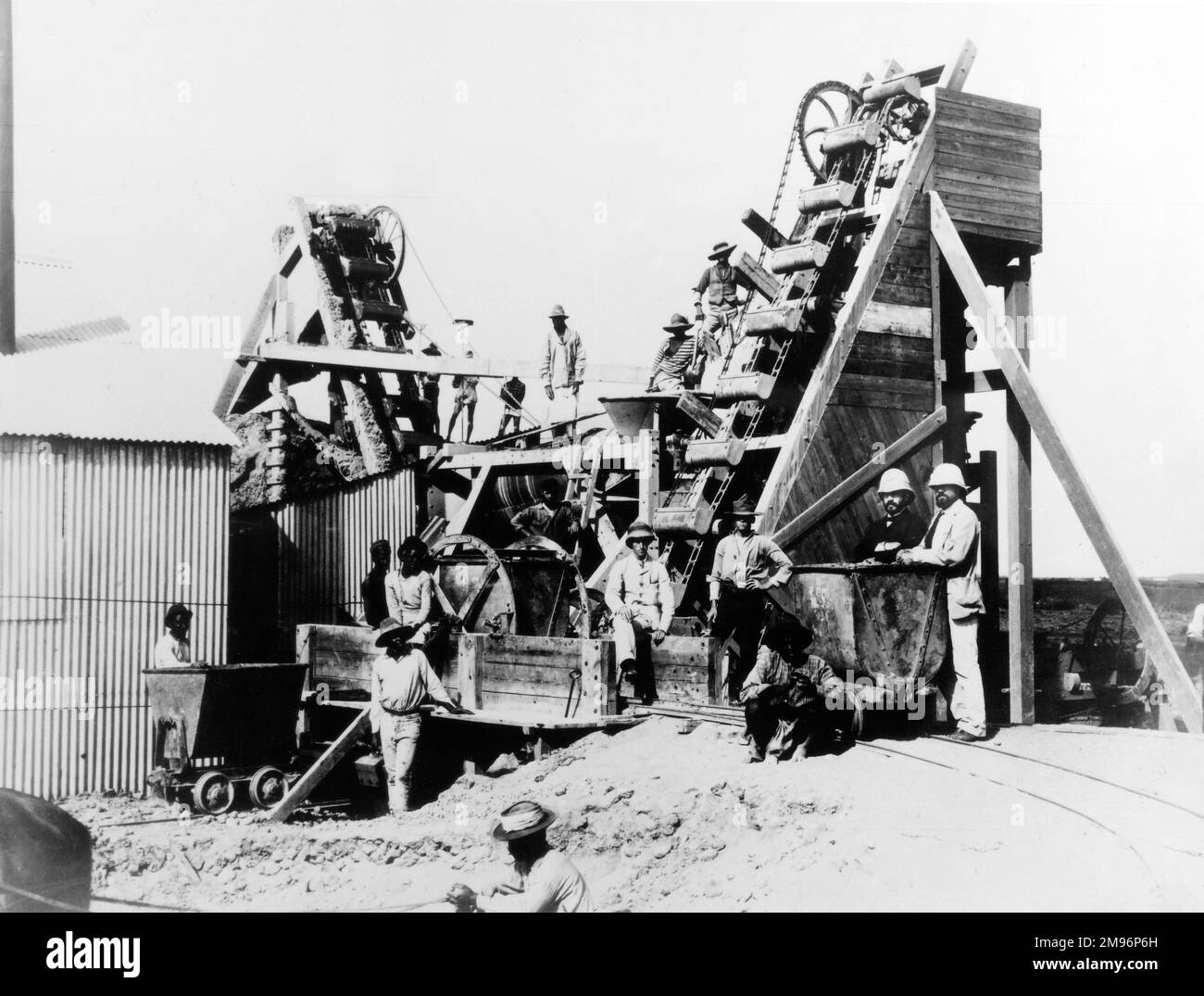 Diamond excavation machinery, and miners at the Kimberley Mine in the ...