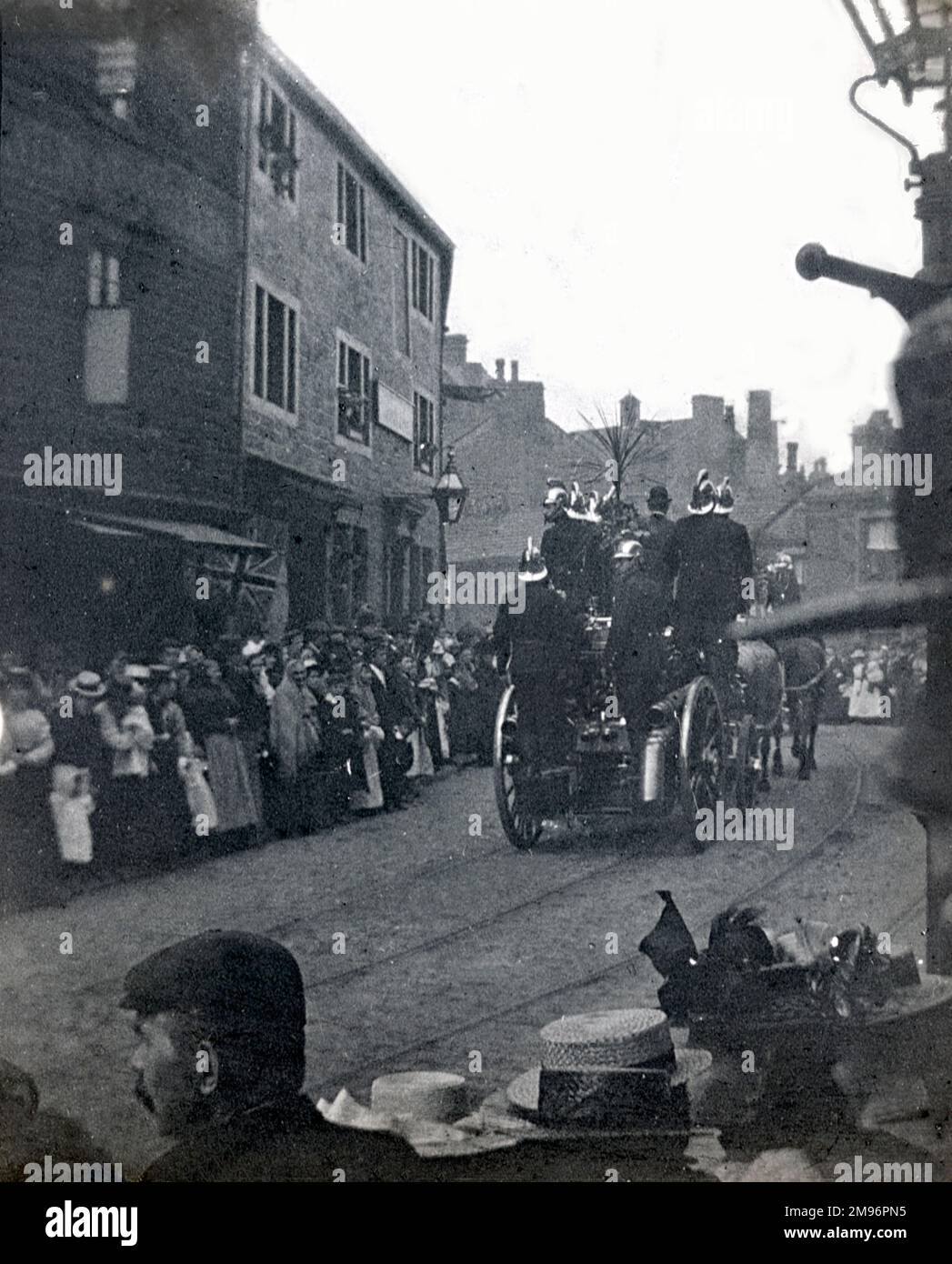 A Horse-drawn Fire Engine pulls quite a crowd Stock Photo - Alamy