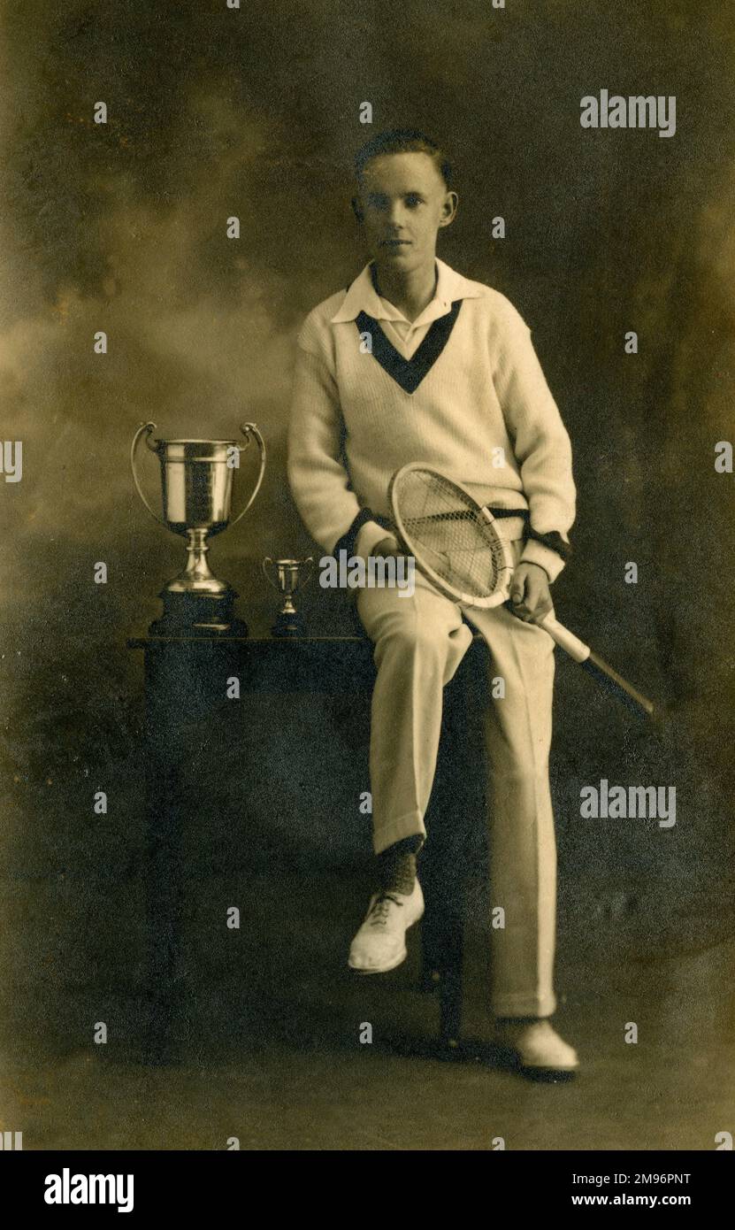Tennis player with trophy Stock Photo - Alamy