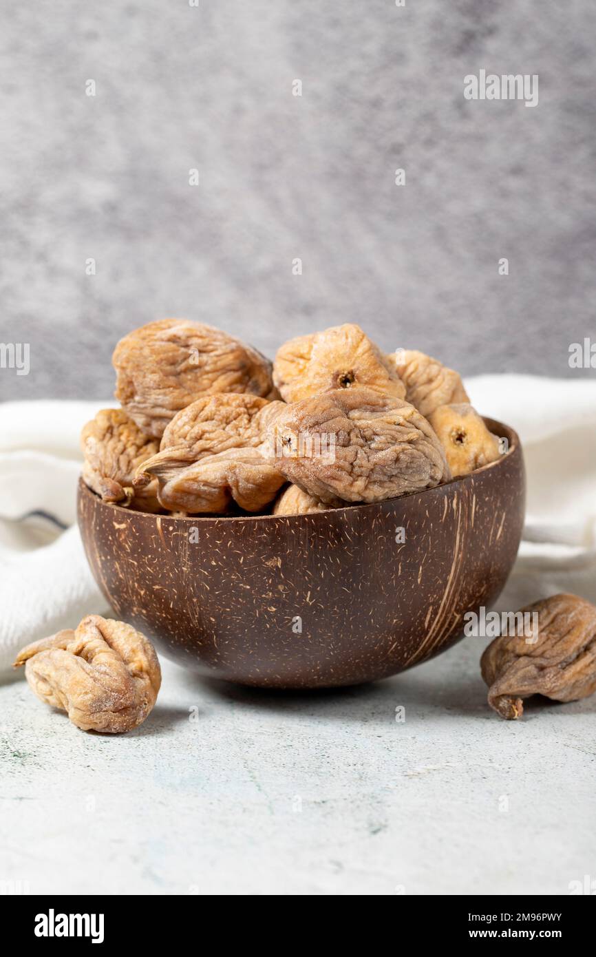 Dried figs on stone background. Sun-dried dried figs in glass bowl ...