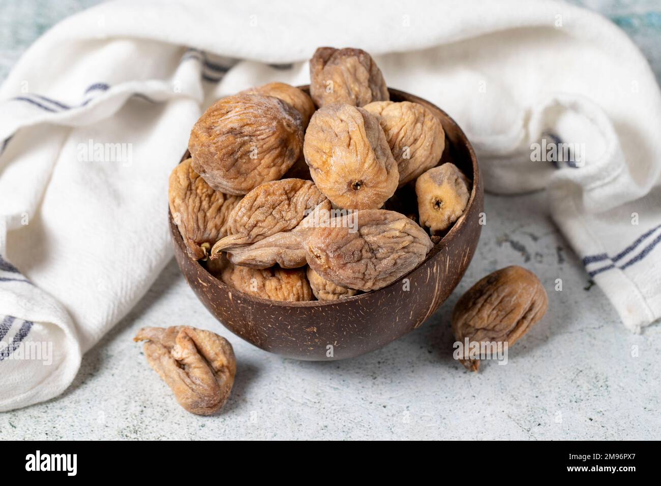 Dried figs on stone background. Sun-dried dried figs in glass bowl ...