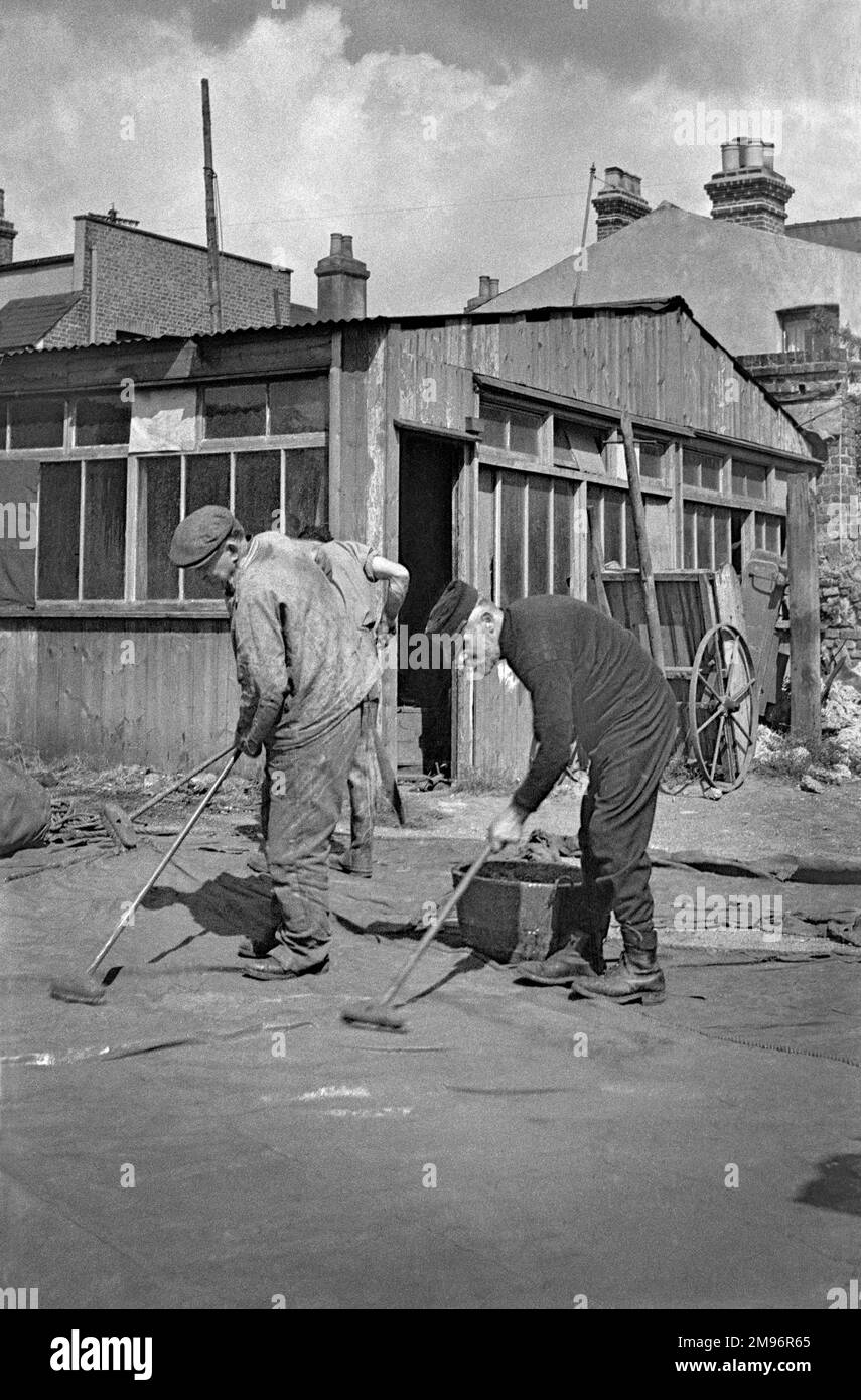 Two men at work with sweeping brushes Stock Photo - Alamy