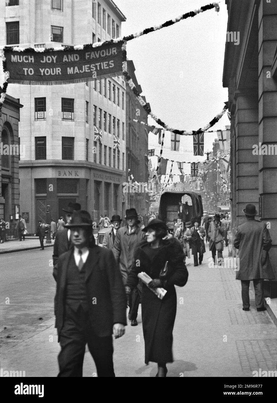 Silver Jubilee street scene in London, with garlands and flags Stock ...