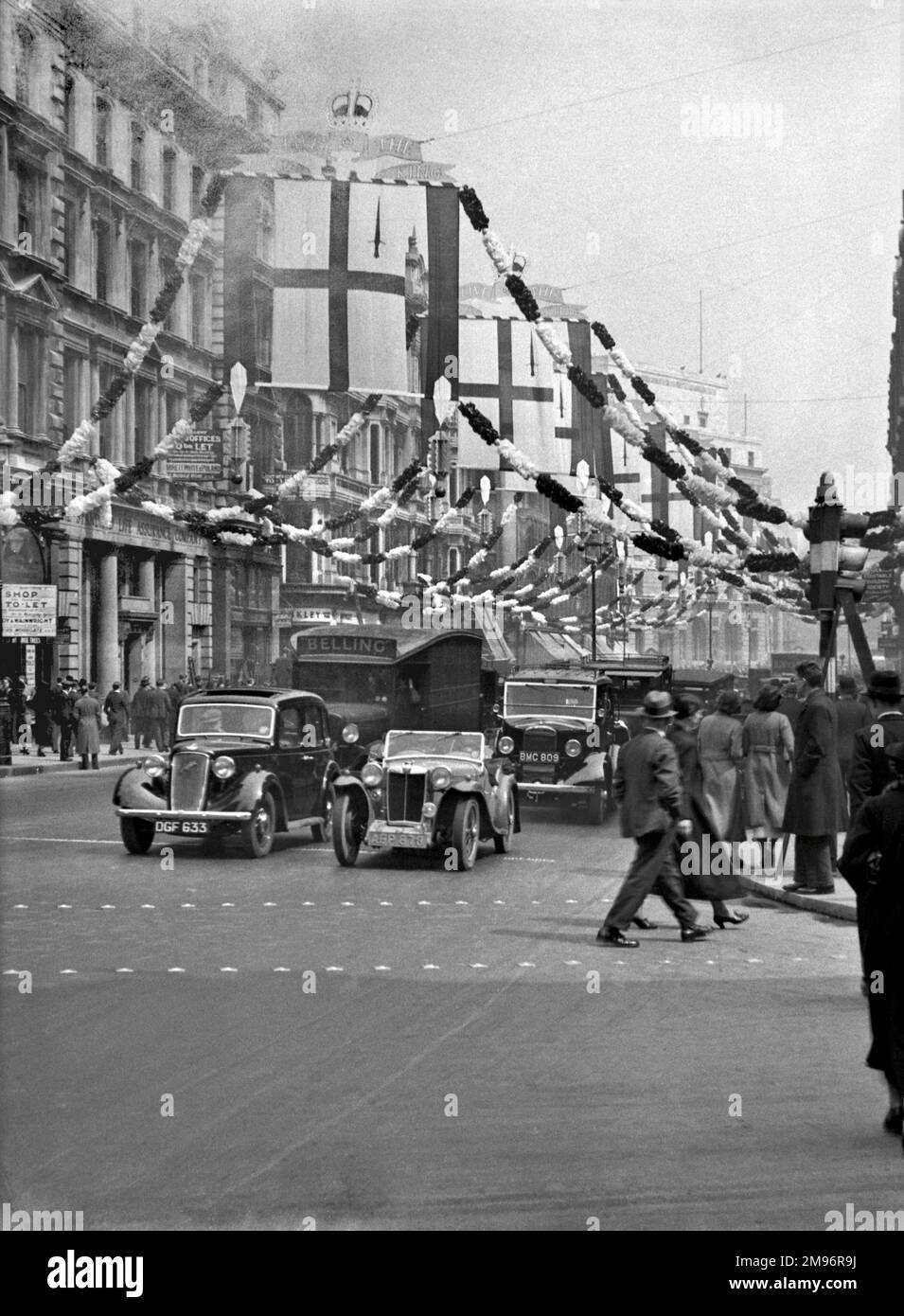 Silver Jubilee street scene in London, with garlands and flags Stock ...