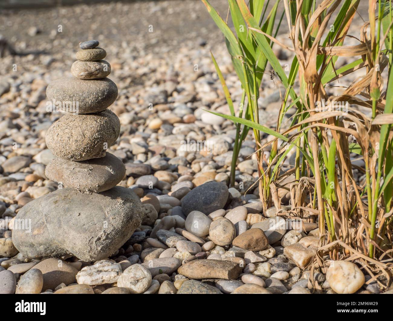 Balance stones on a river Stock Photo - Alamy