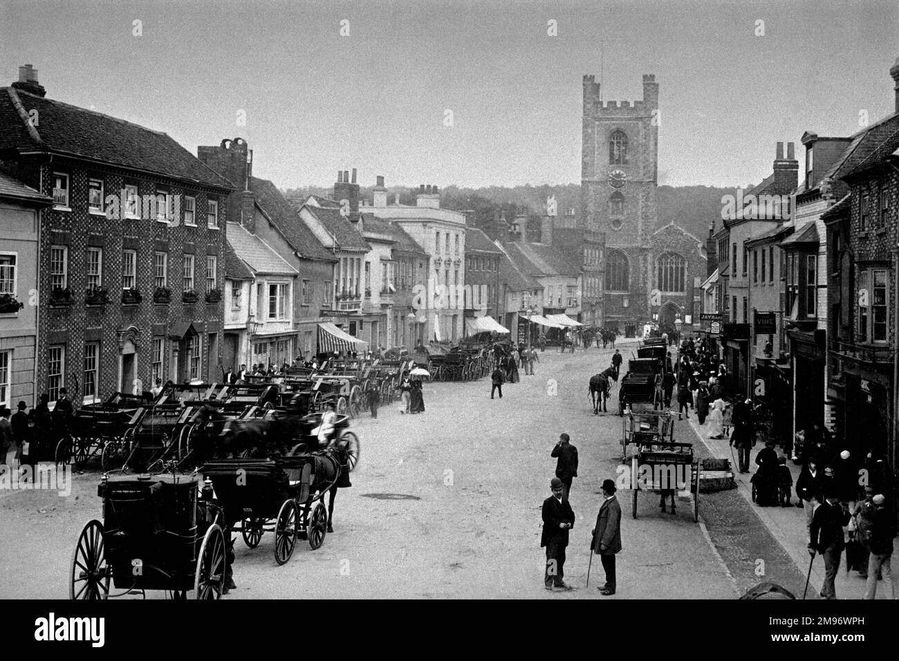 Busy street scene looking down Hart Street toward St. Mary's Church ...