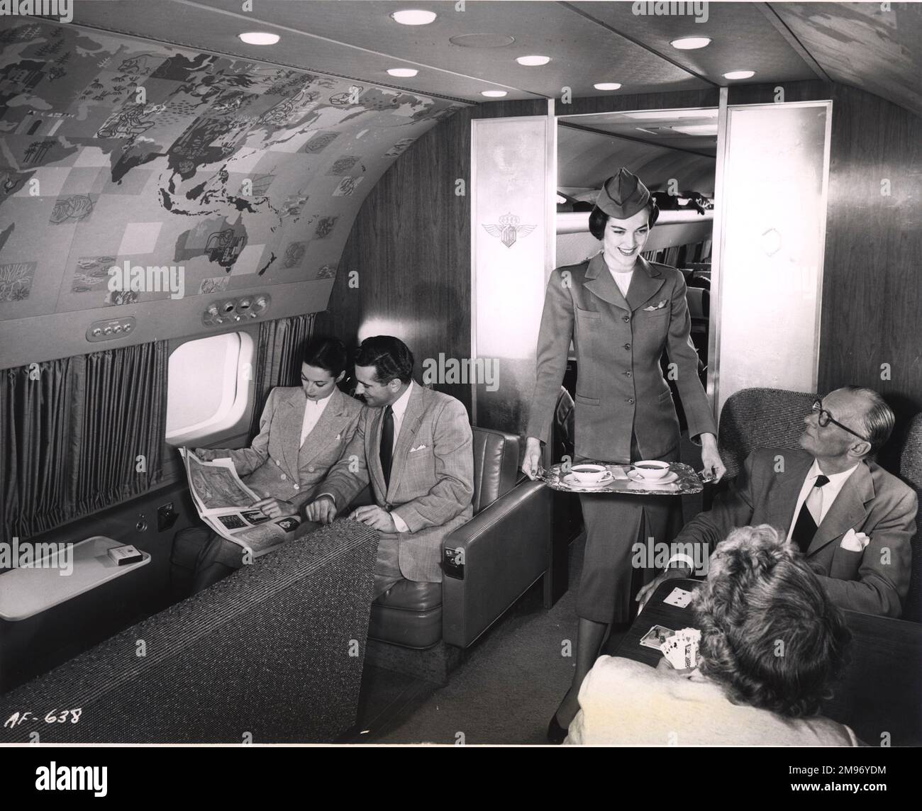 A stewardess serves tea in a mock-up of the eight-seat lounge of a ...
