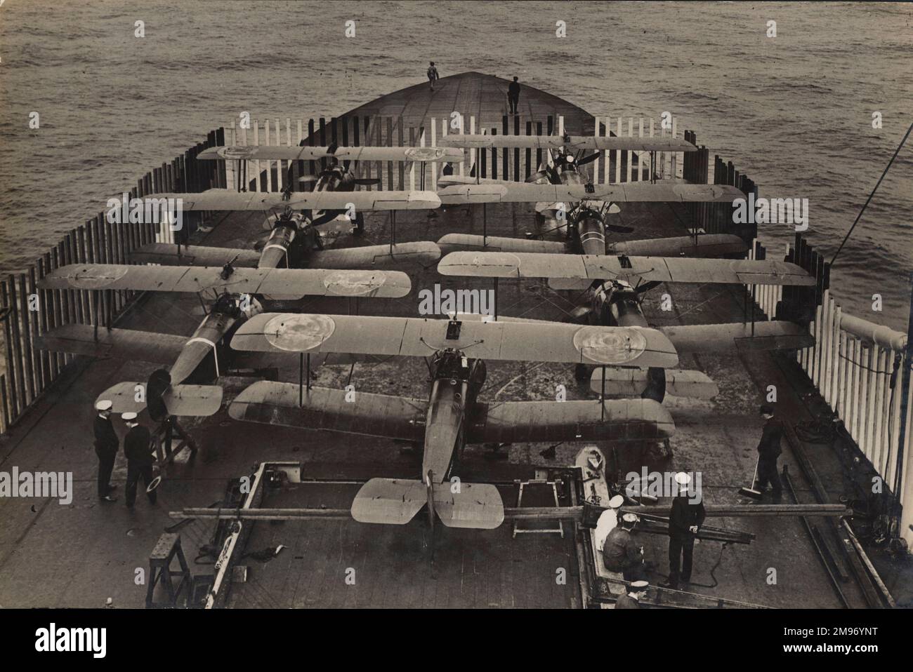 Seven Sopwith 2F1 Camels lined up on the deck of HMS Furious prior to ...