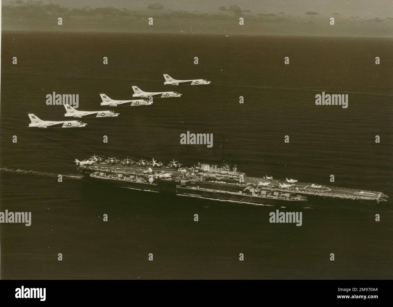 Five Vought F8U-1 Crusaders from VF-211 enter the landing pattern over ...