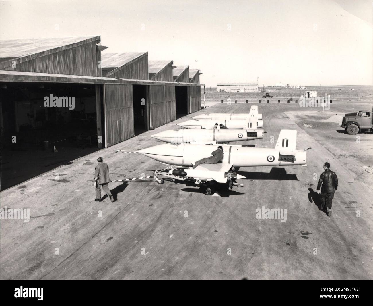 Jindivik Mk2s, including A92-52, lined up outside the hangar at Evetts ...