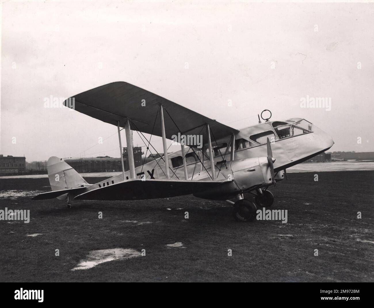 de Havilland DH84 Dragon, VH-UZX, of Air Travel & Survey Pty equipped ...
