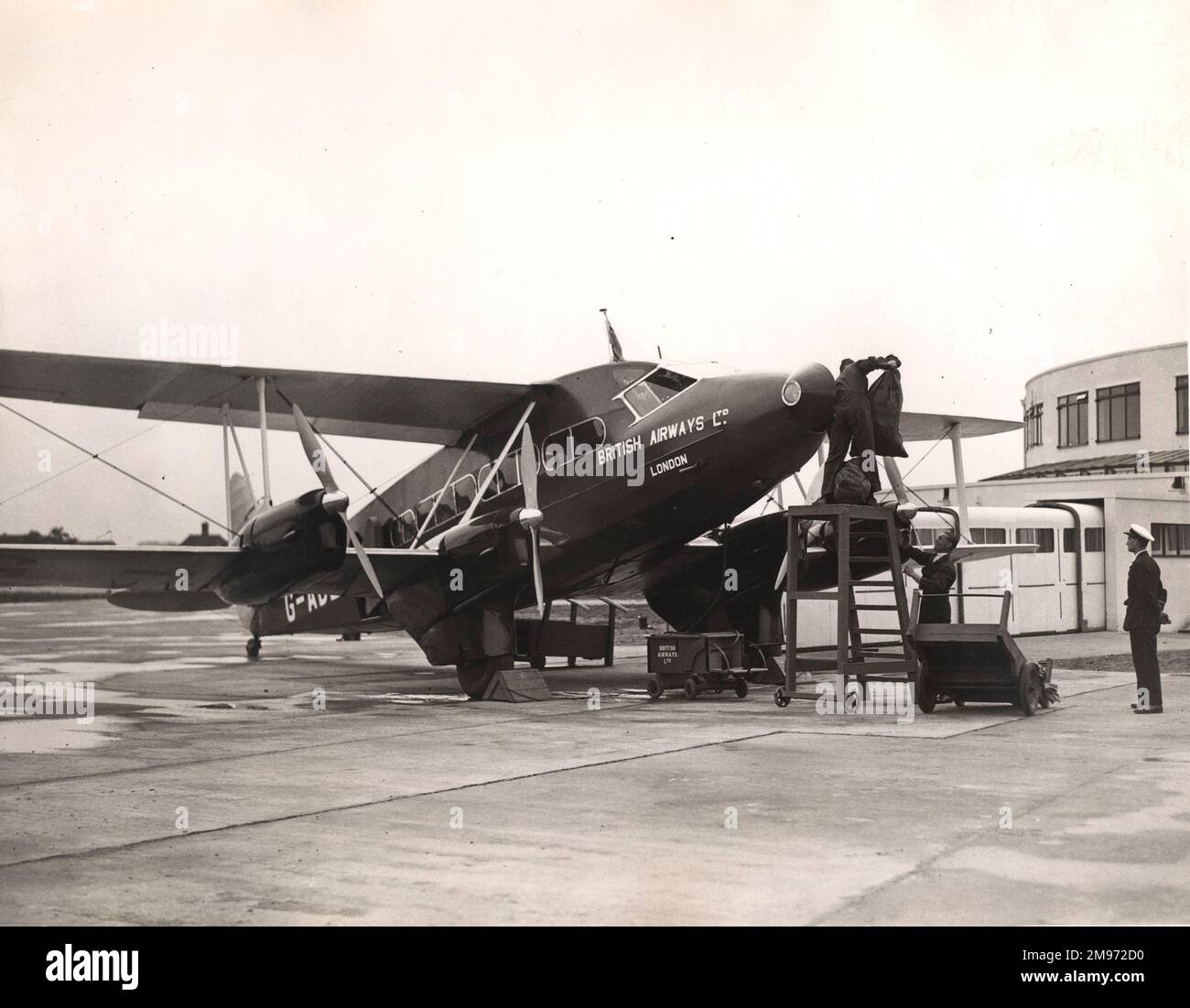 de Havilland DH86 Express Air Liner of British Airways being loaded ...