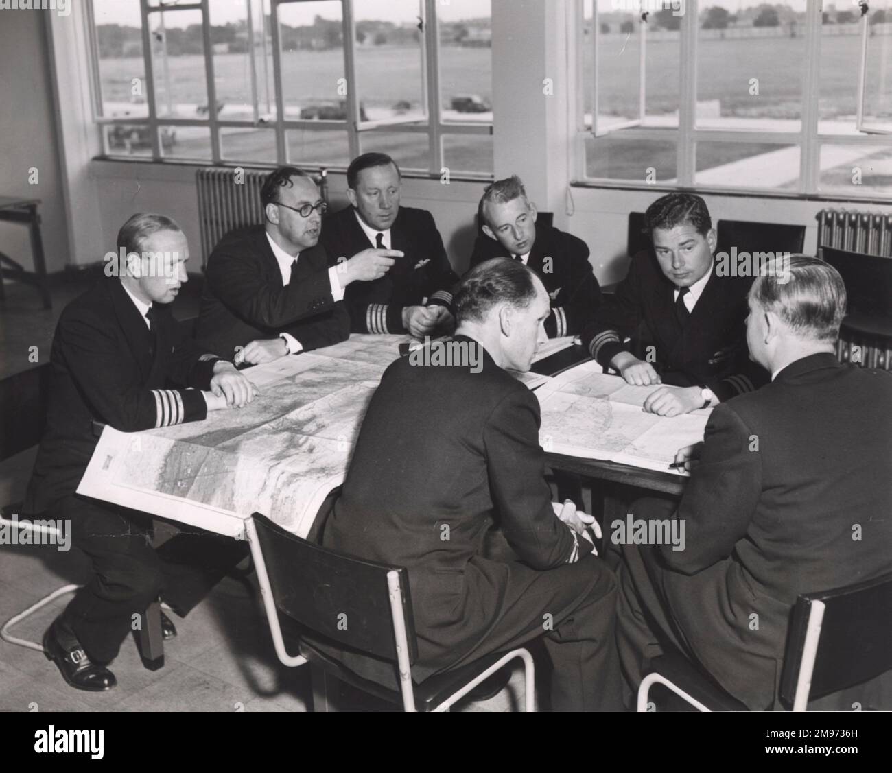 Members of BEA’s England to New Zealand race crew discussing the route ...