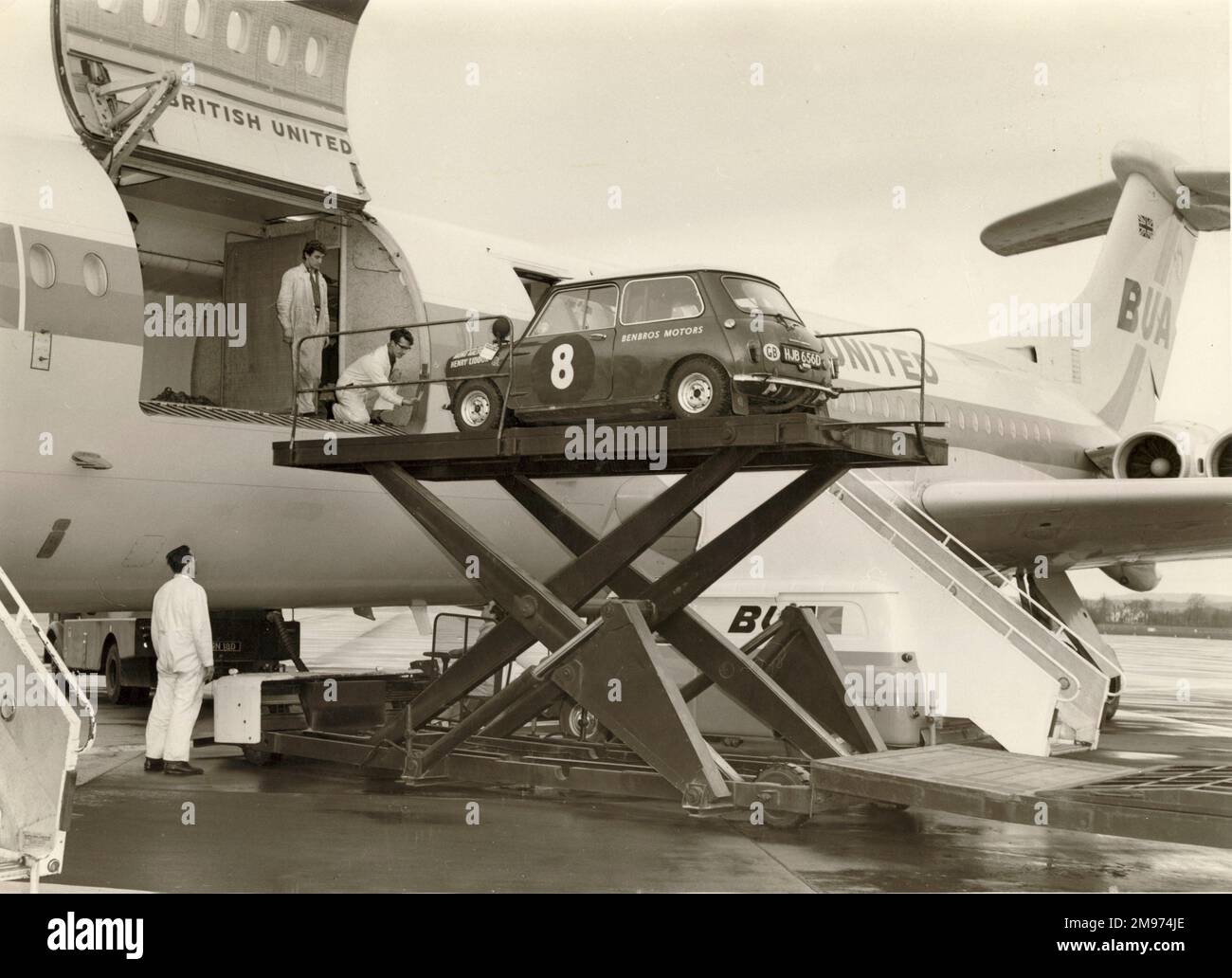 A mini car being loaded through the side cargo door of a Vickers VC10 ...