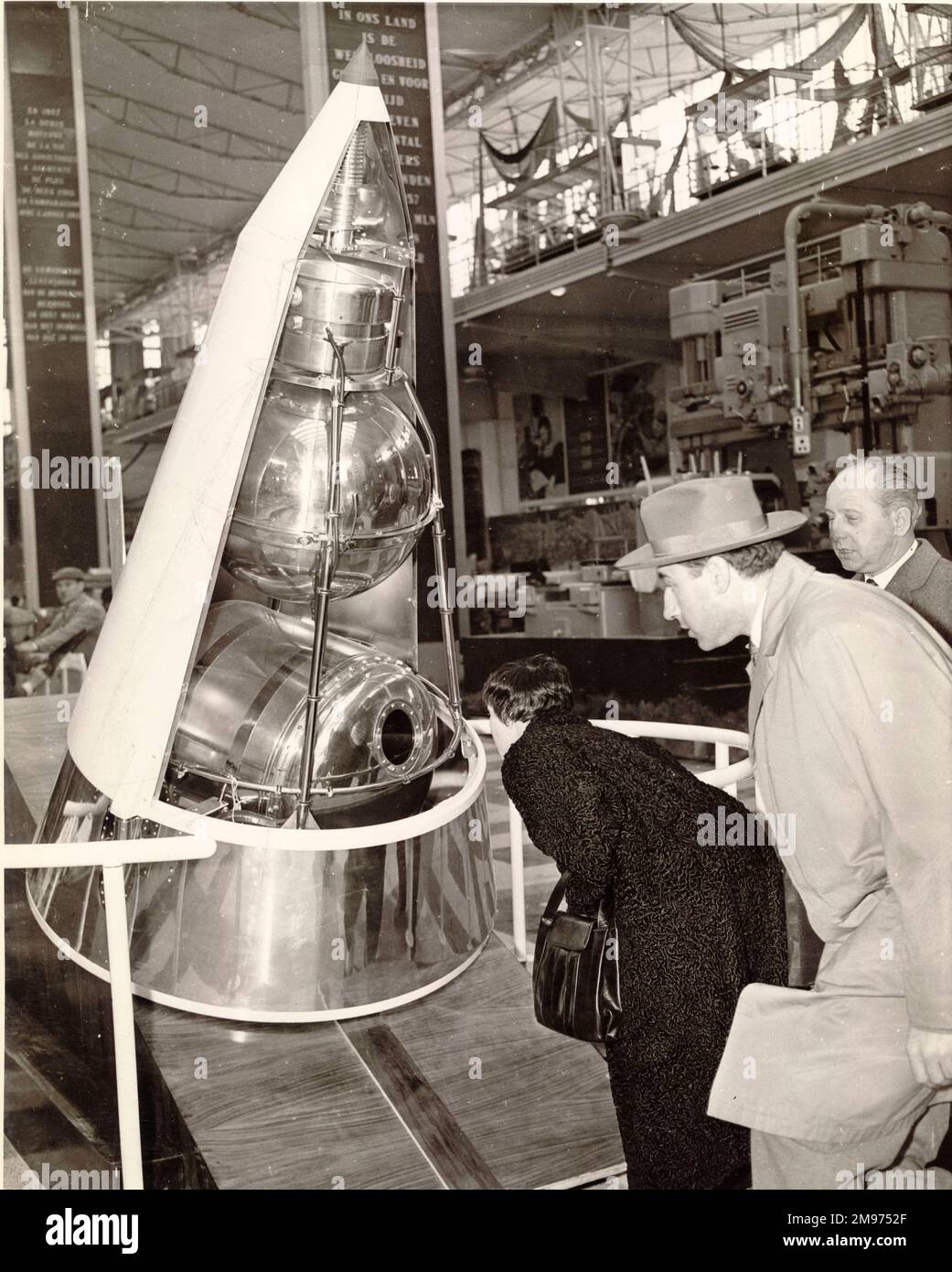 A model of Sputnik II in the Soviet Pavilion at the Brussels Fair. 16 ...