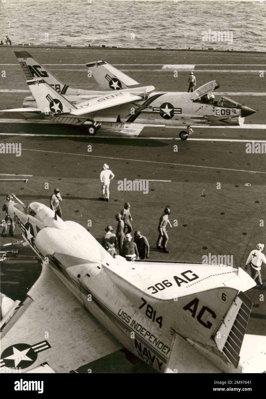 A Vought F8U Crusader manoeuvres past Douglas A-4C Skyhawk, 147814 ...