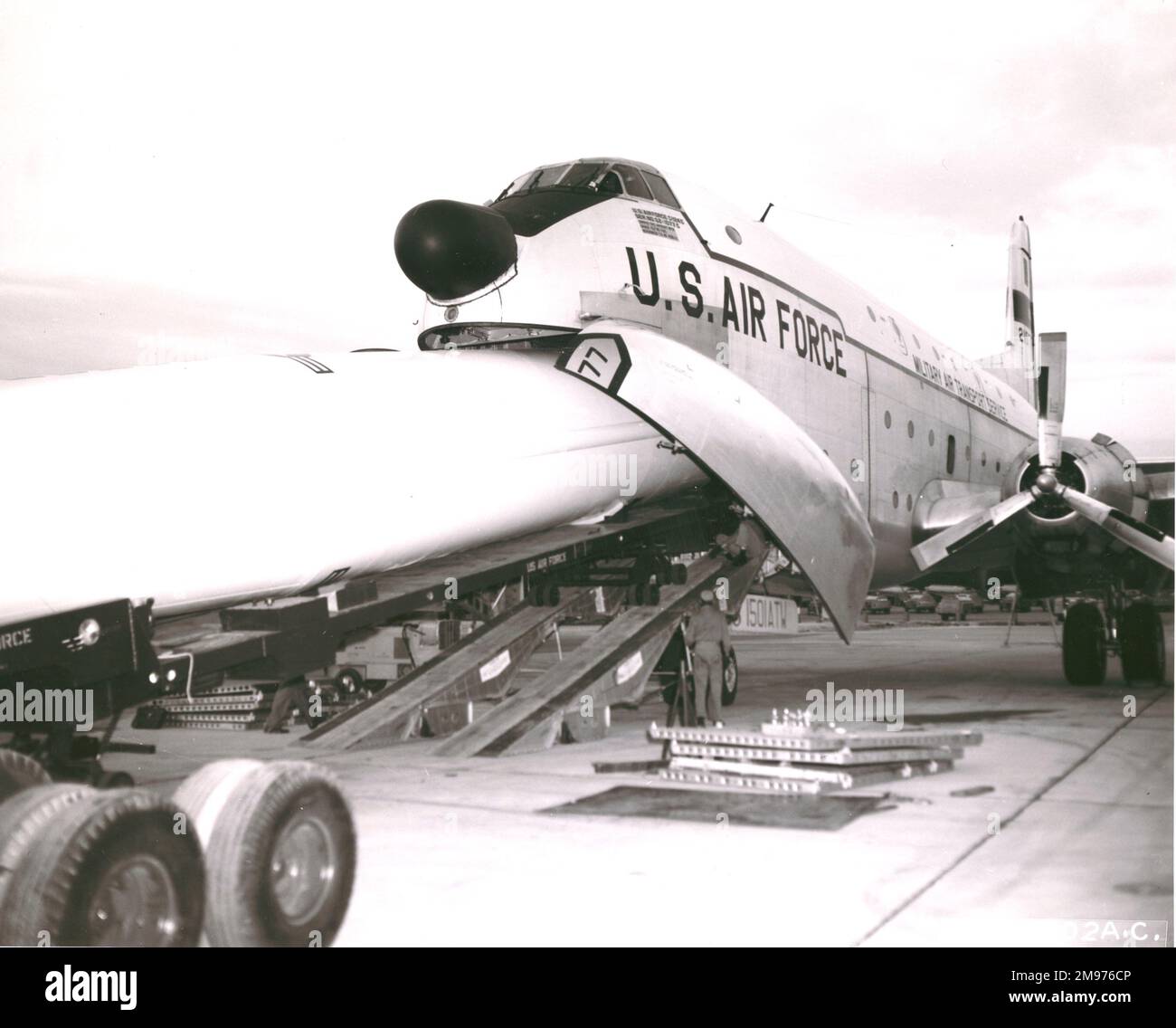 A Thor missile is loaded into a Douglas C-124 Globemaster II at Andrews ...