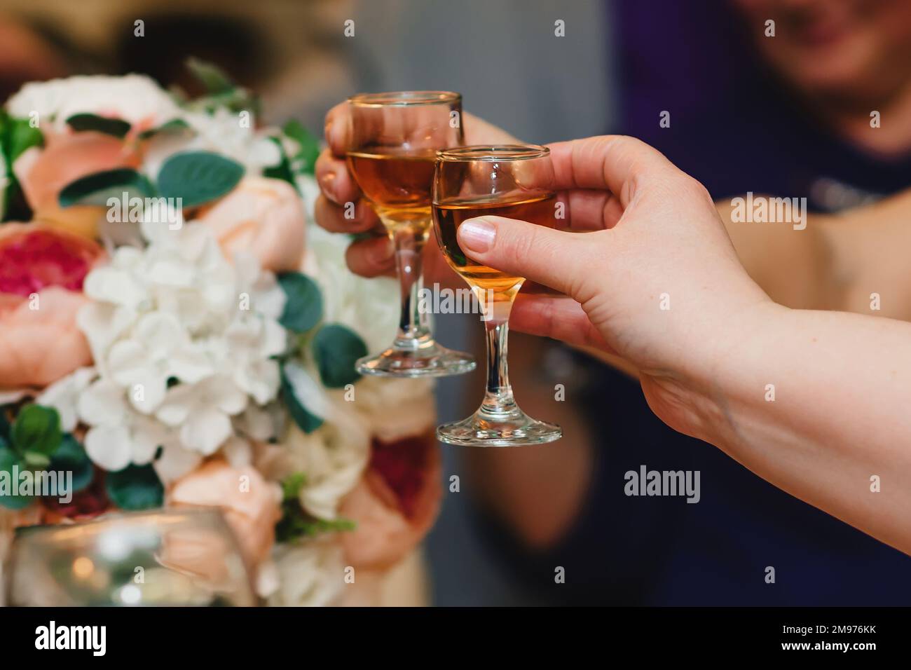 Hands glasses cognac in hi-res stock photography and images - Alamy