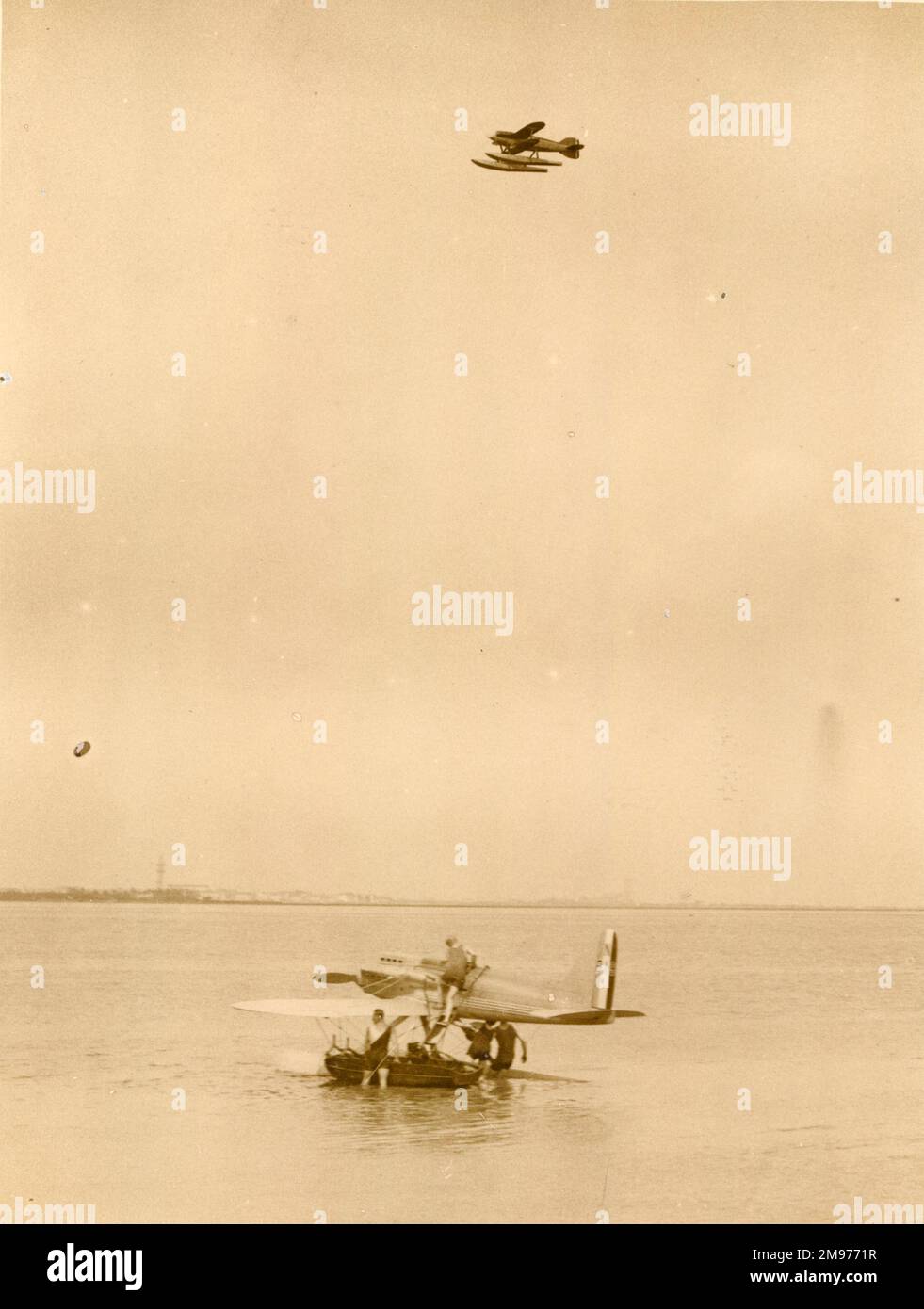 A Gloster IV flies over a Supermarine S5 in Venice in 1927 Stock Photo ...