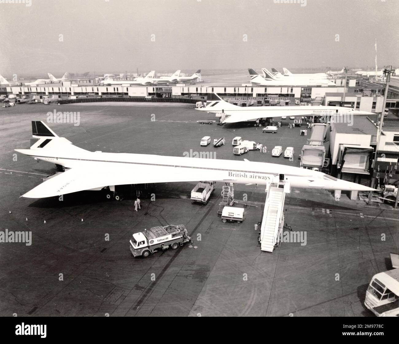 A pair of British Airways Concordes (including G-BOAA) on the tarmac at Heathrow Airport Stock ...
