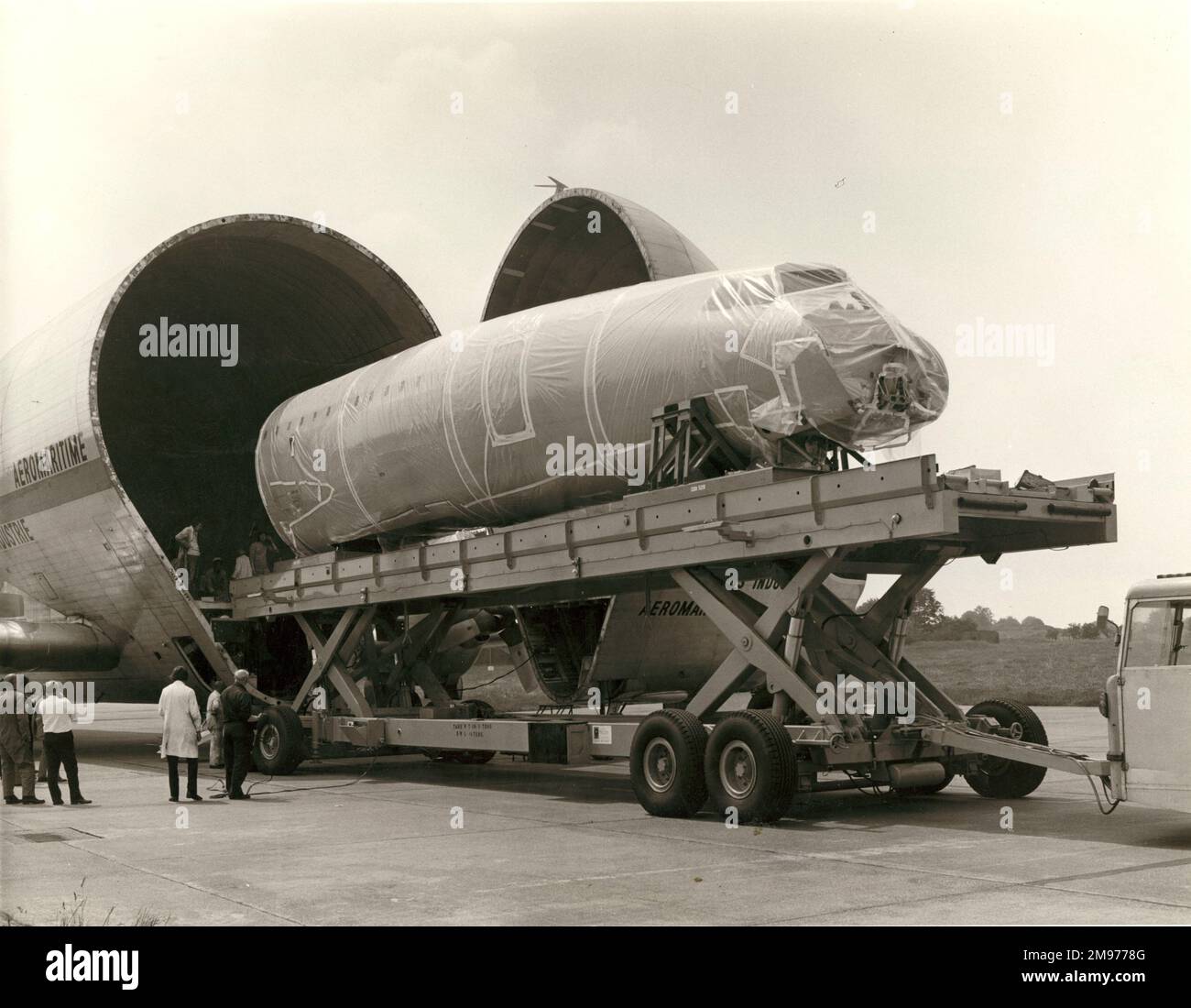 A Concorde forward fuselage is loaded into an Airbus Super Guppy for ...
