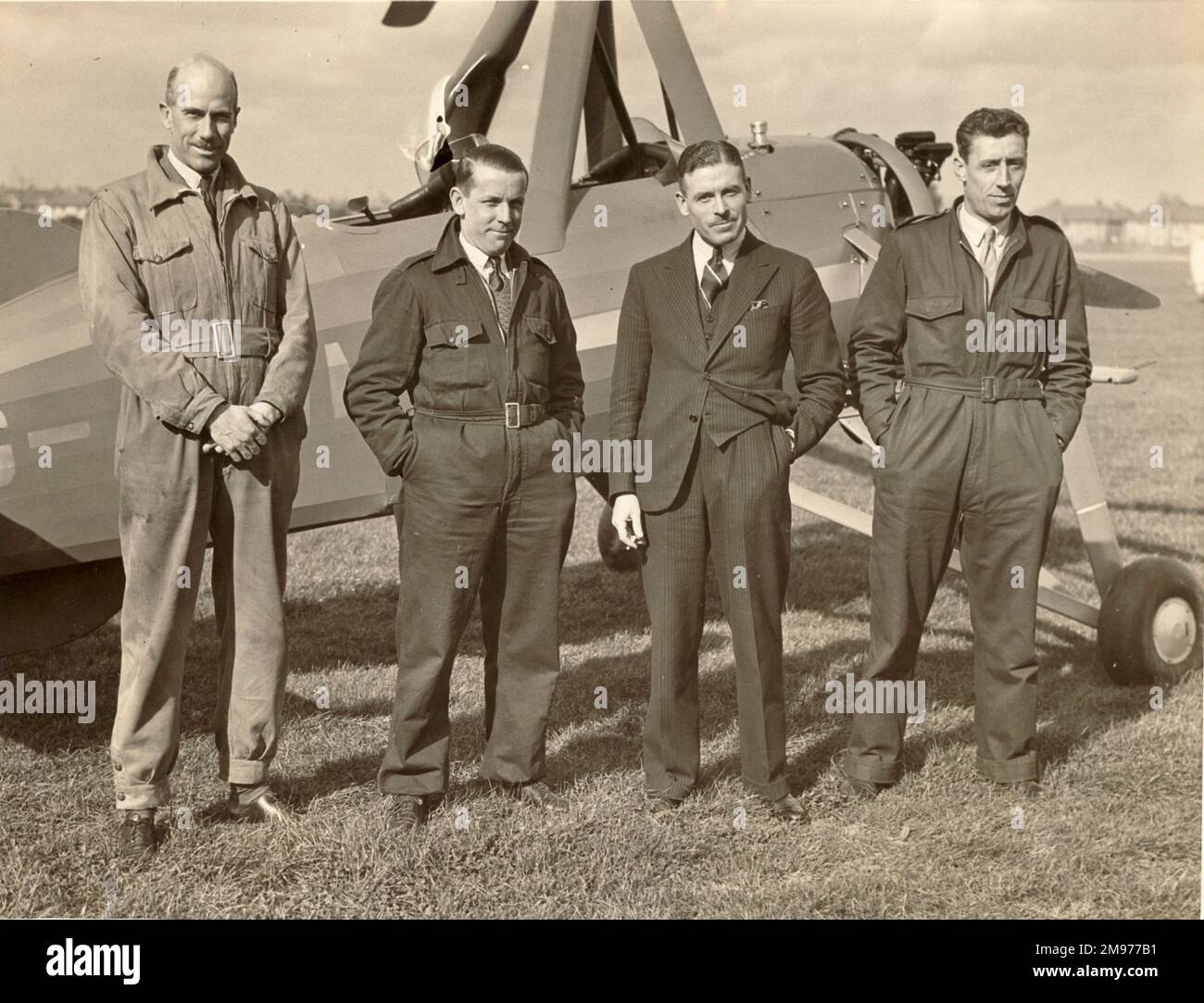 A group of four alongside an Avro 671 Cierva C30A. The group possibly ...