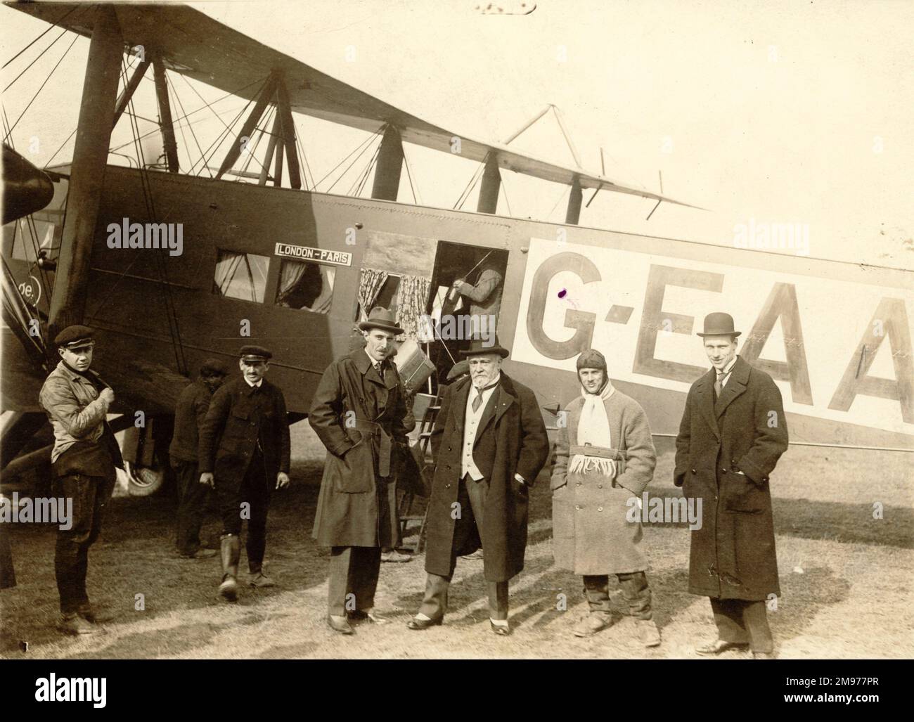 Pilot Capt Gordon P. Olley, Imperial Airways (wearing the scarf), with ...