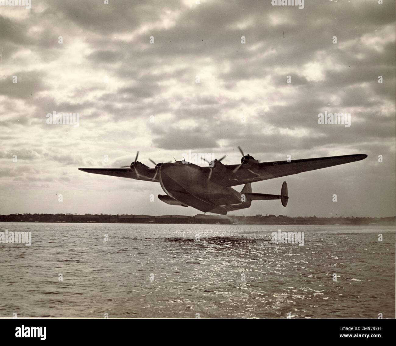 Boeing 314 Clipper of Pan American Airways takes-off from the seaplane base at La Guardia Field ...