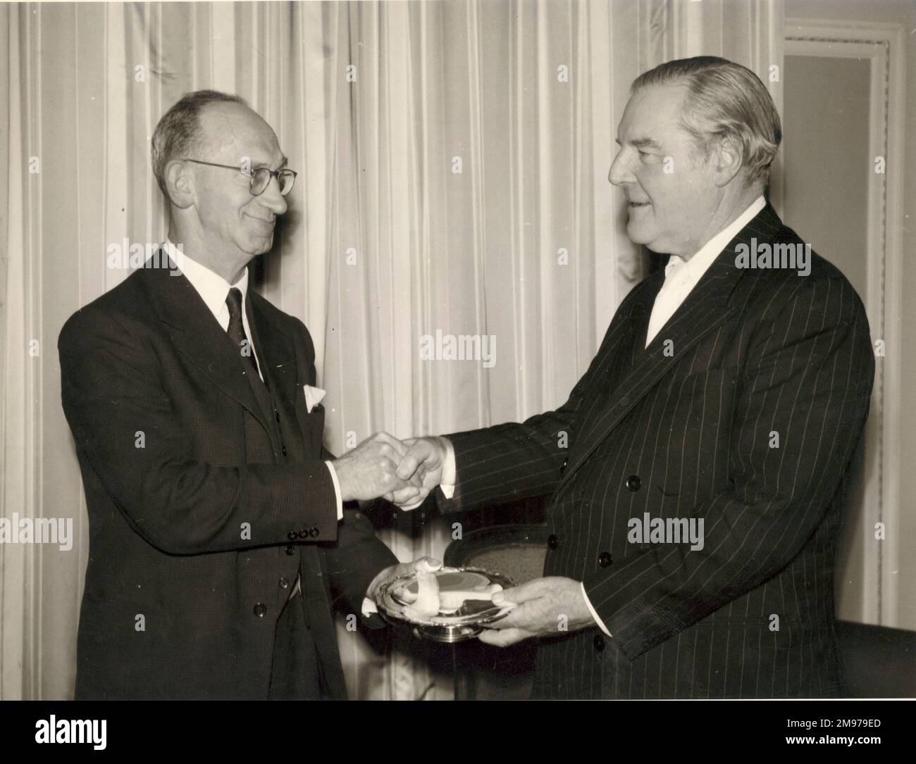N.E. Rowe, CBE, FRAeS, RAeS President 1955-1956, left, presents Major ...