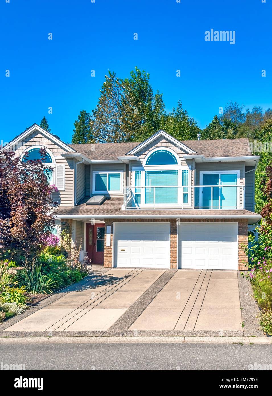 Big residential house with double garage and concrete drive way Stock ...