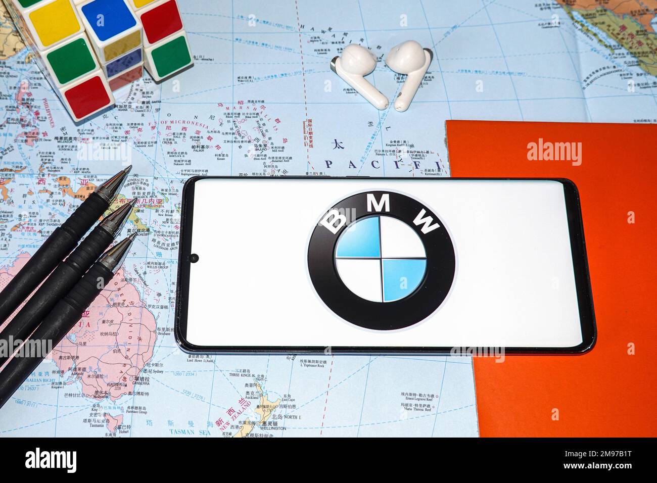 In this photo illustration, a BMW Group logo is displayed on the screen ...