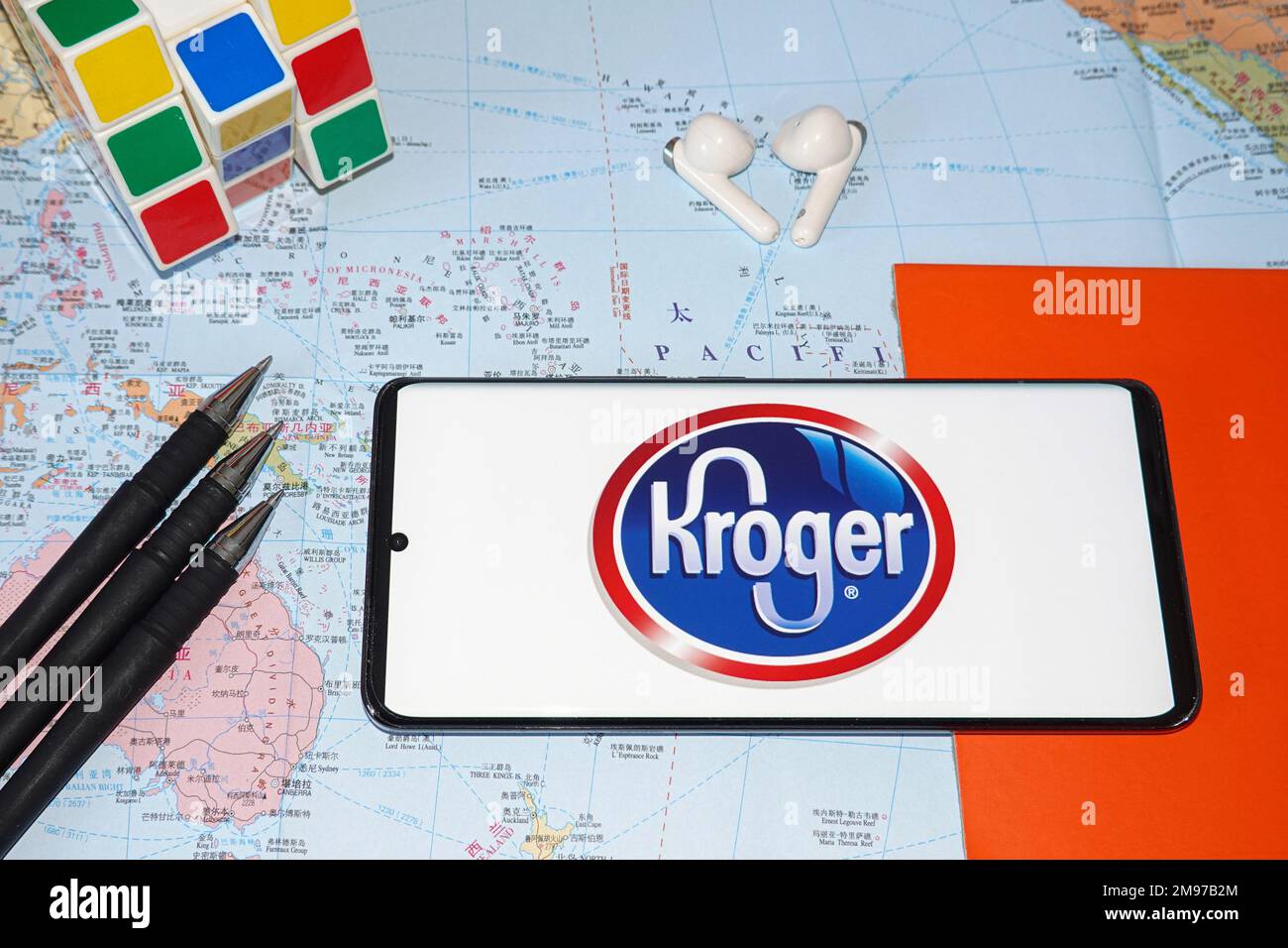 In this photo illustration, a Kroger logo is displayed on the screen of ...
