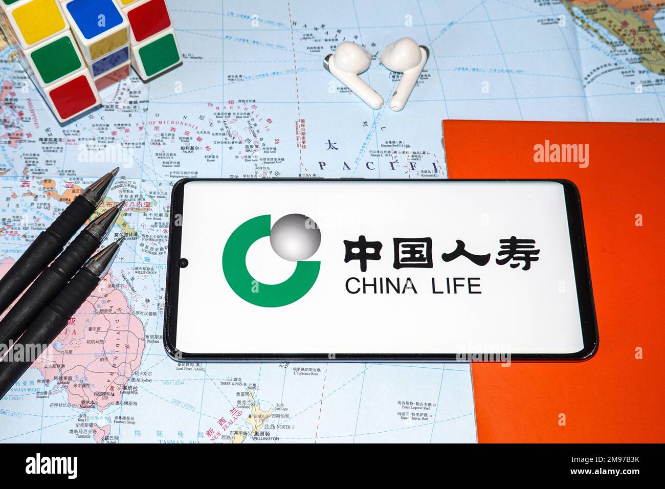 In this photo illustration, a logo of China Life Insurance is displayed ...