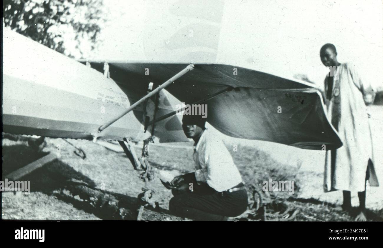 Natives repair tailplane (McCarthy Island). Miss Delphine Reynolds and ...