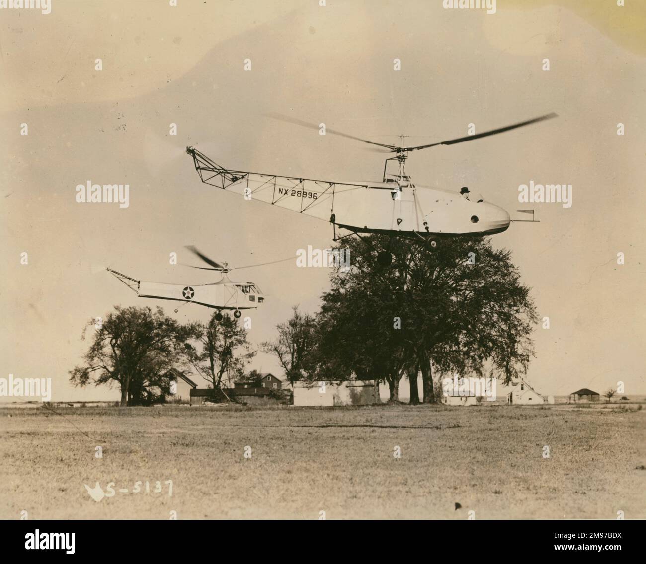 Igor Sikorsky at the controls of the Sikorsky VS-300 (front) with the ...