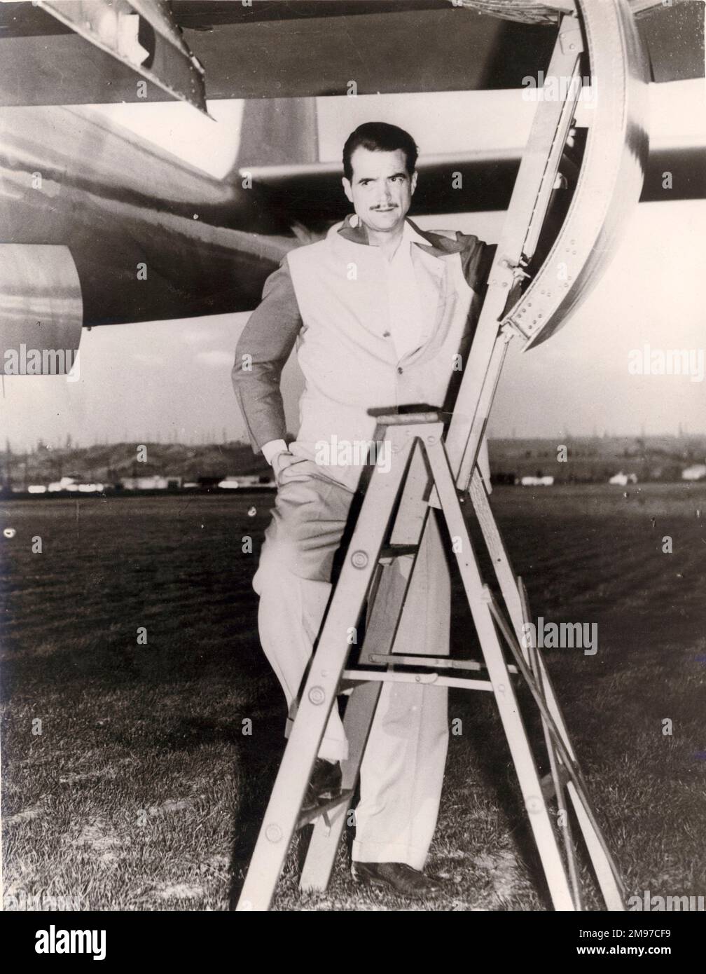 Howard Robard Hughes (1905-1976) about to board the second Hughes XF-11 ...