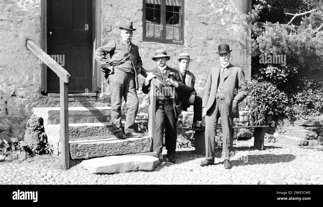 Four men at Erbistock Ferry, near Chester, in June 1908 Stock Photo - Alamy