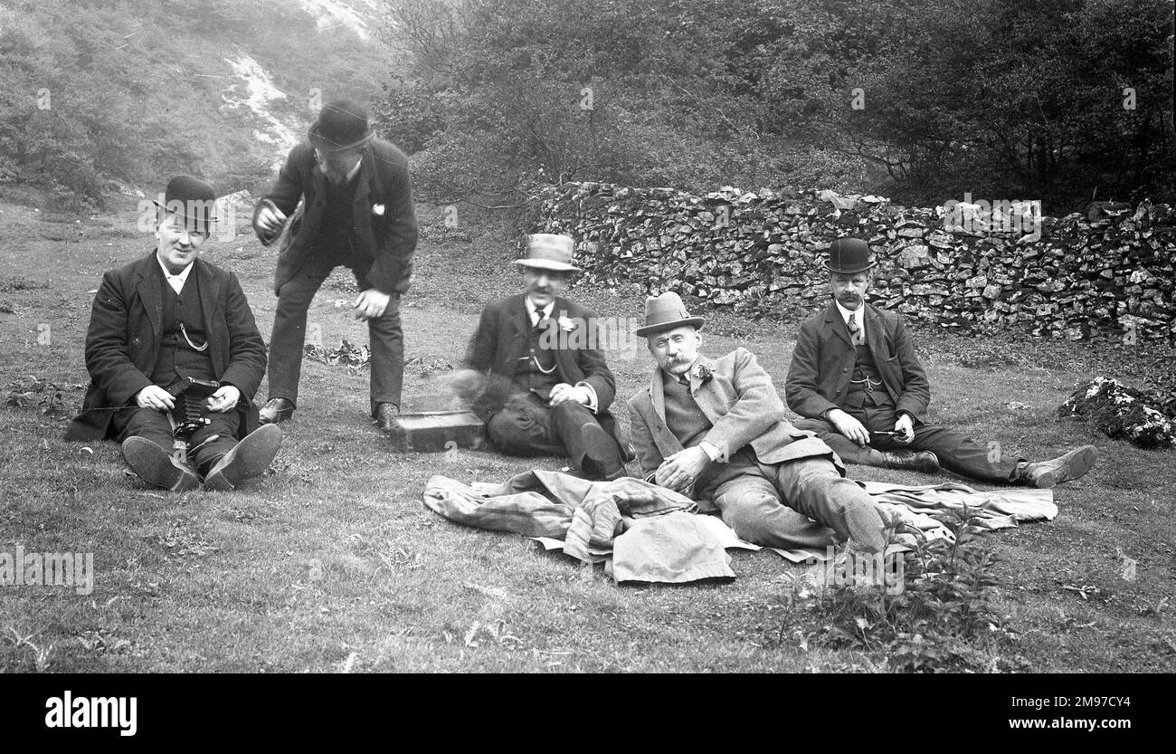 Group of men in Dovedale, one with a bellows camera of the period ...