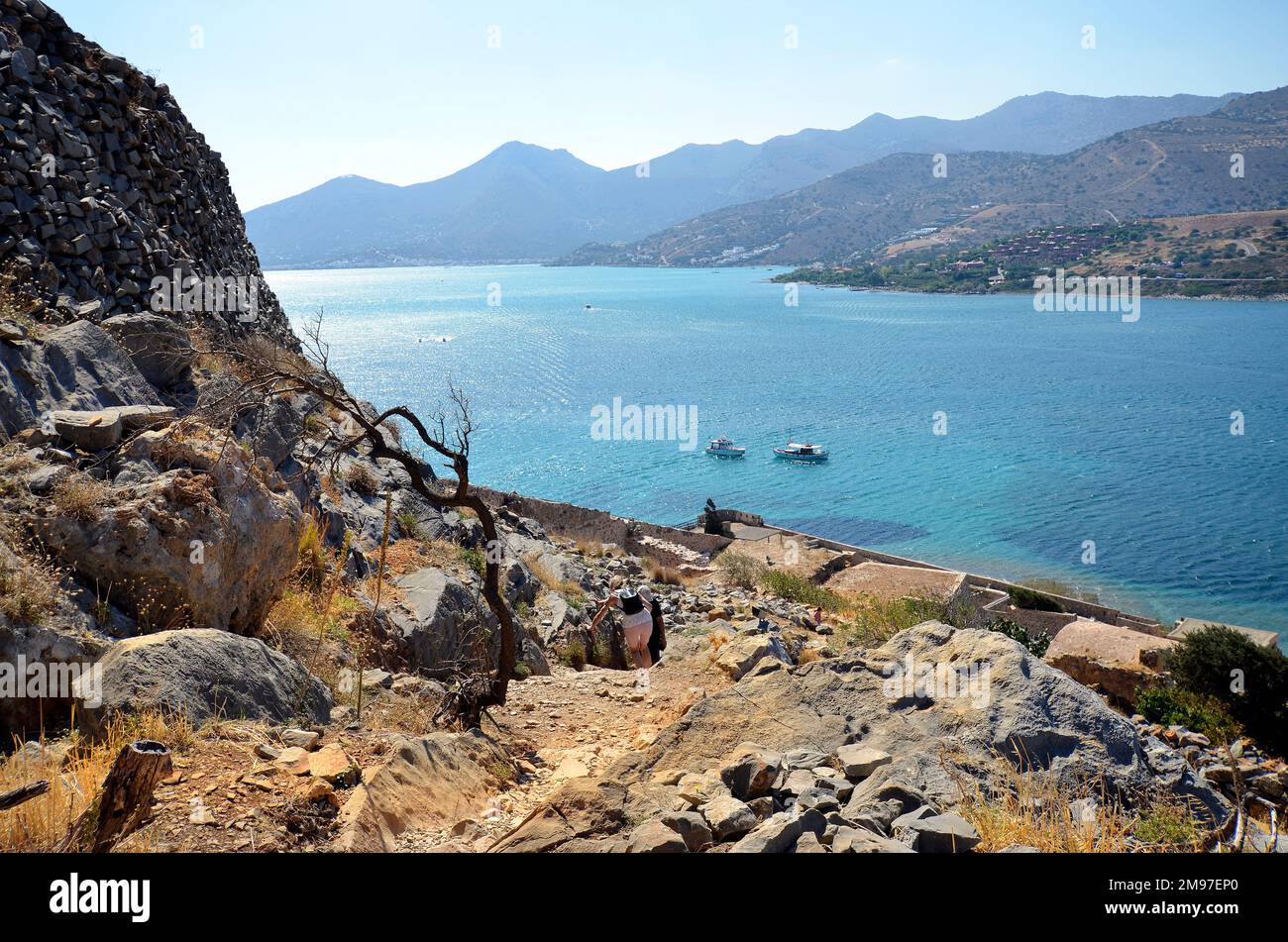 Greece, Crete, tourists on a difficult footpath visiting the old ...