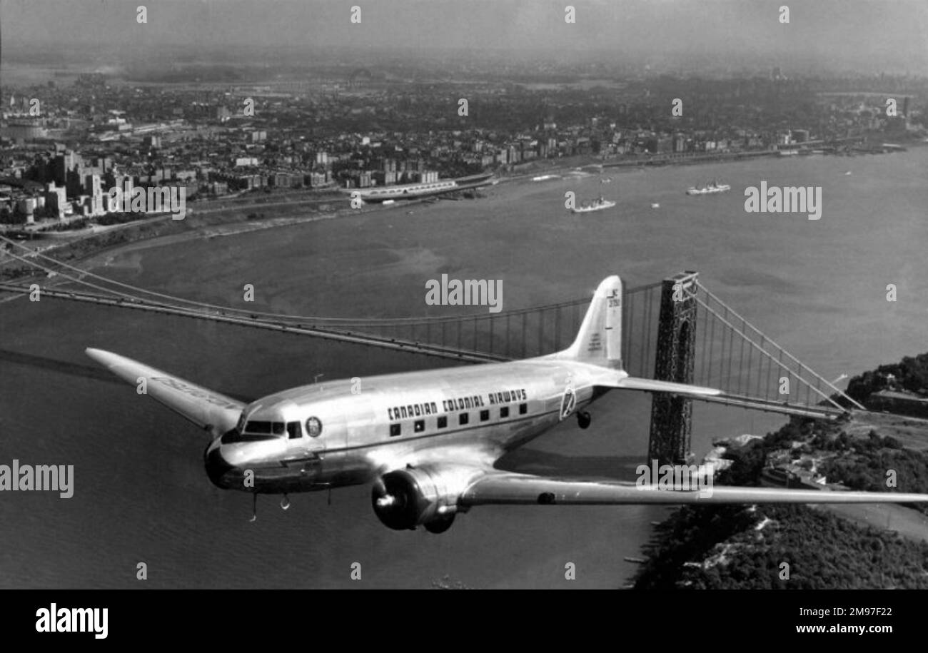 Douglas DC-3 of Canadian Colonial Airways over George Washington Bridge ...