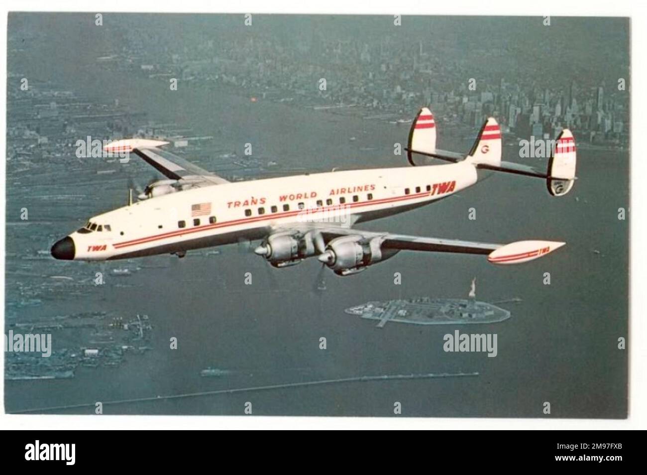Lockheed 1049G Super Constellation of TWA over New York City, '55 Stock ...